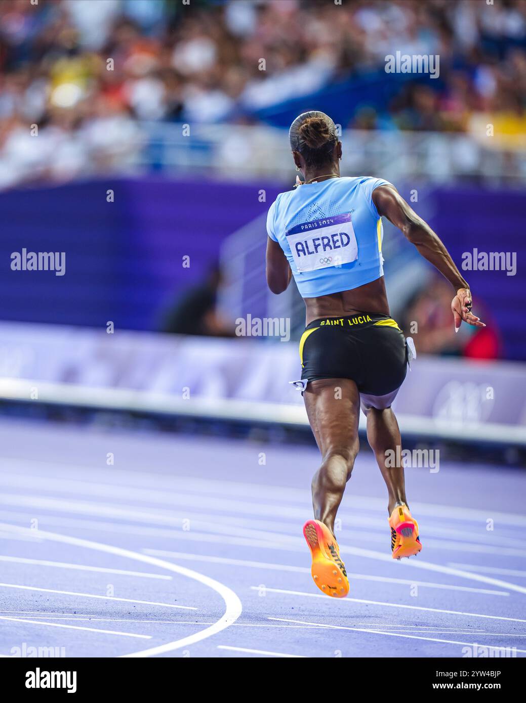 Julien Alfred participating in the 200 meters at the Paris 2024 Olympic ...