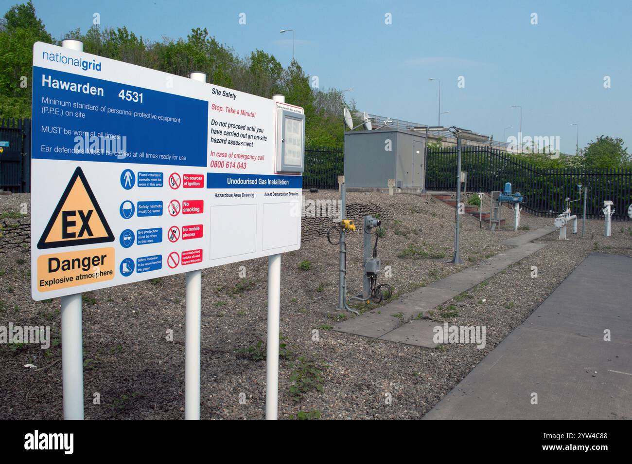 A site safety notice board with hazard symbols at national grid ...
