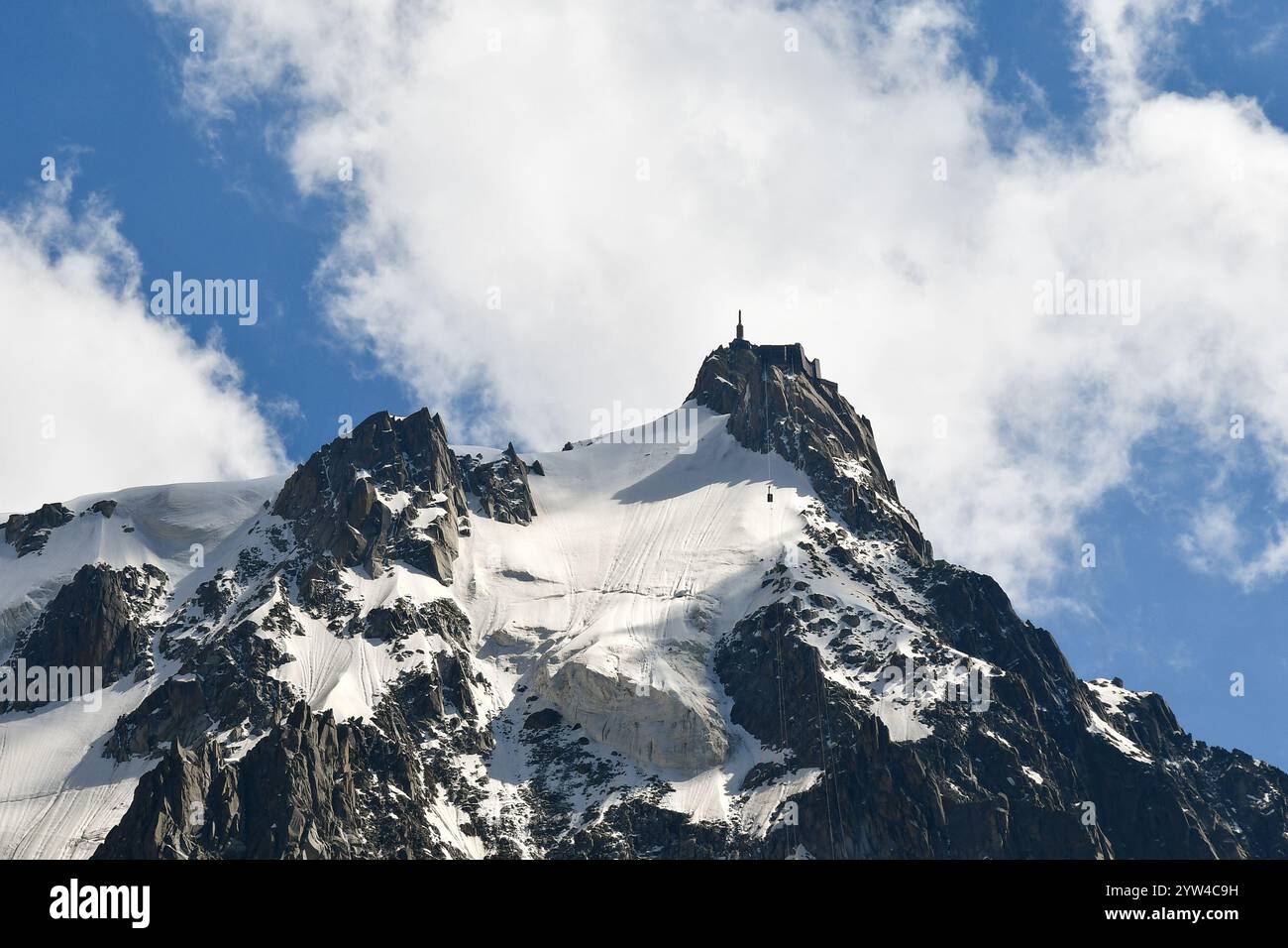 The peak of the Aiguille du Midi, a 3,842-metre-tall mountain in the Mont Blanc massif, in the ...