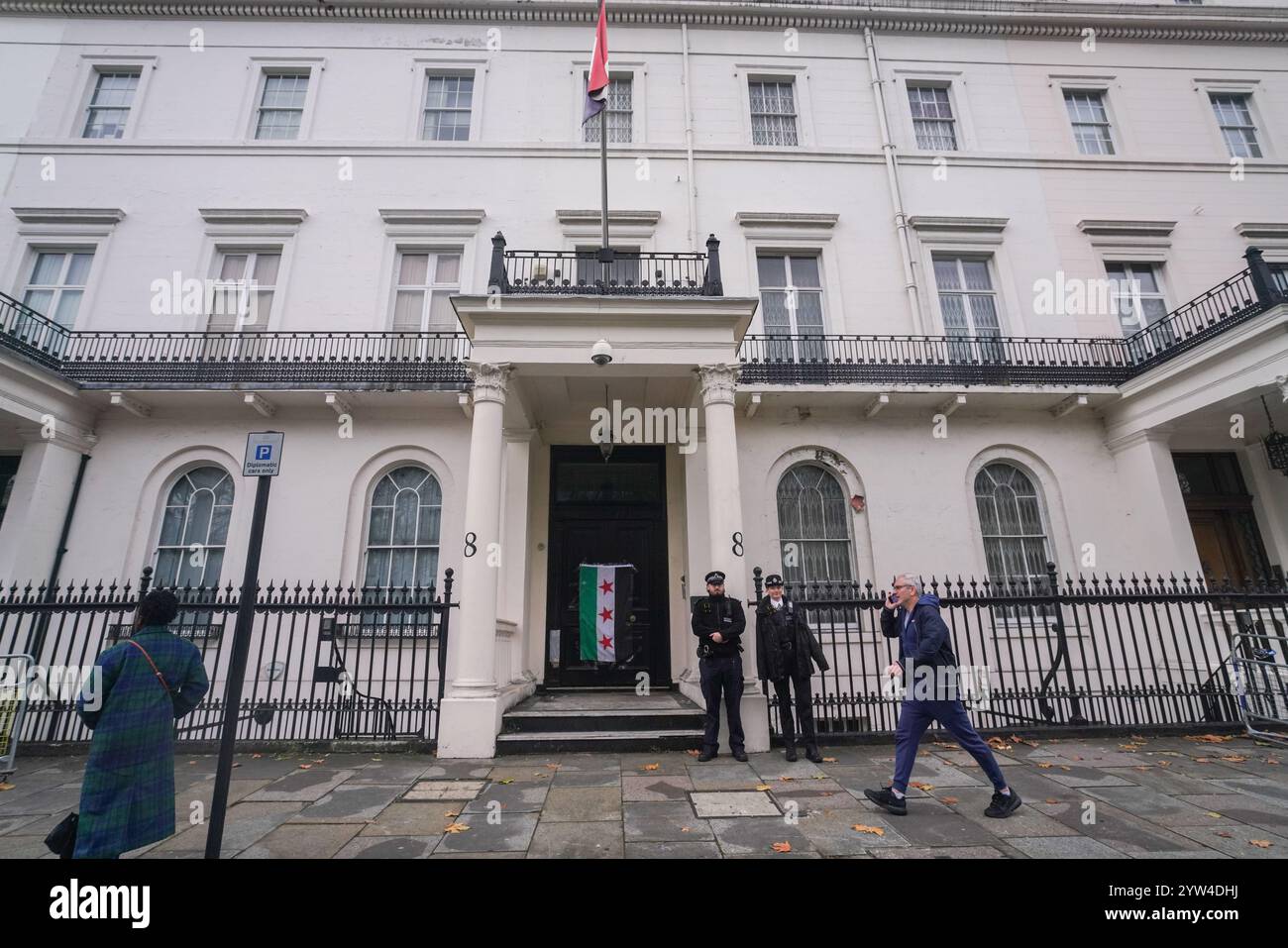 London, UK. 9 December 2024 The Syrian opposition flag is attached to ...