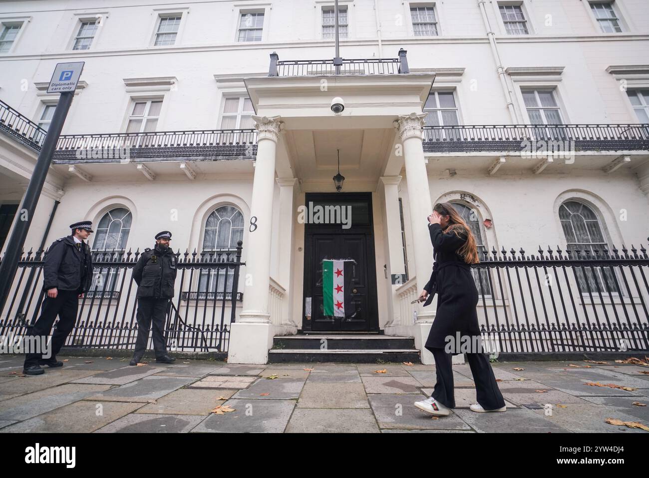 London, UK. 9 December 2024 The Syrian opposition flag is attached to ...