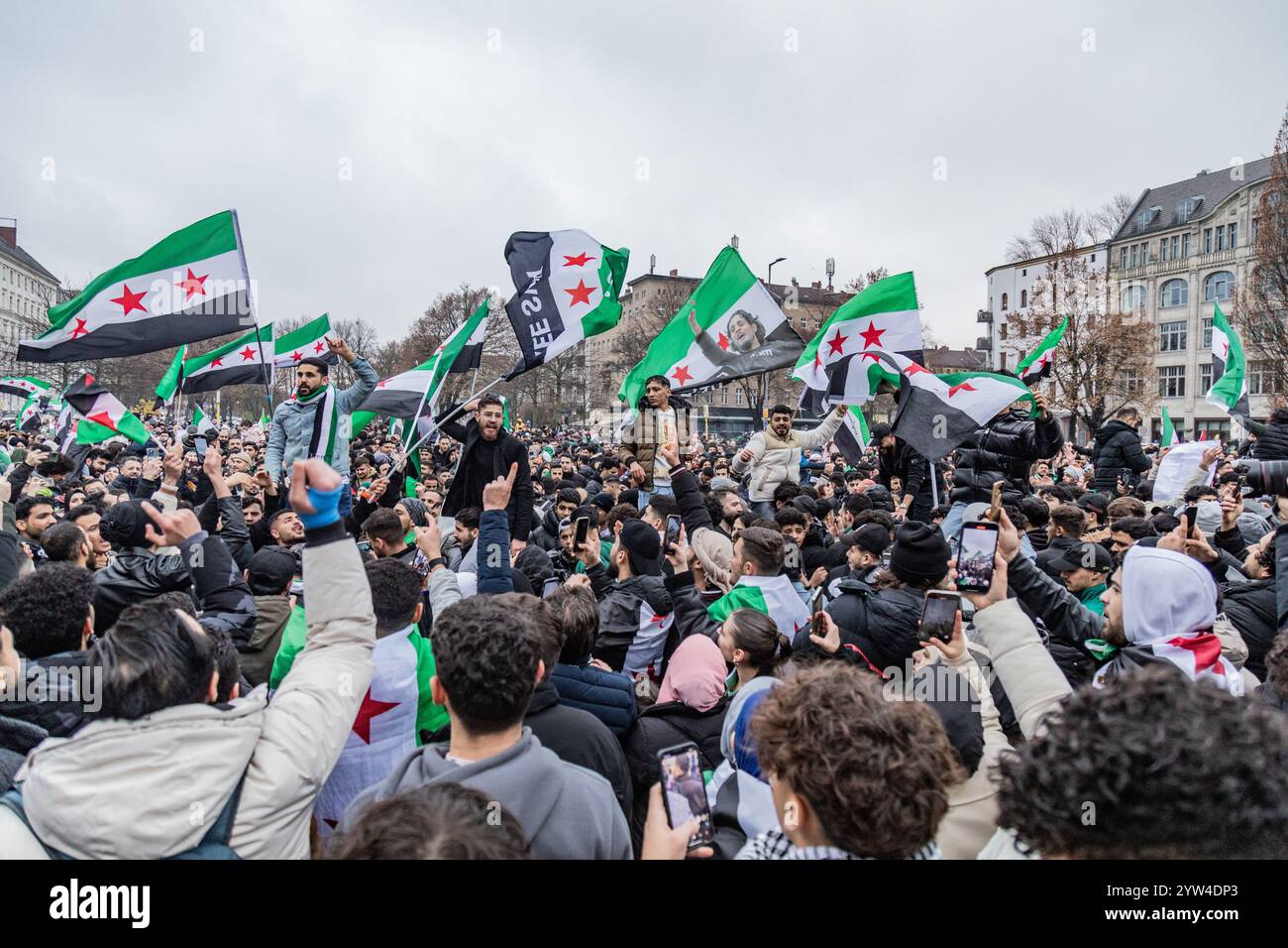 Berlin, Germany. 08th Dec, 2024. People wave "Free Syrian Army" flags ...
