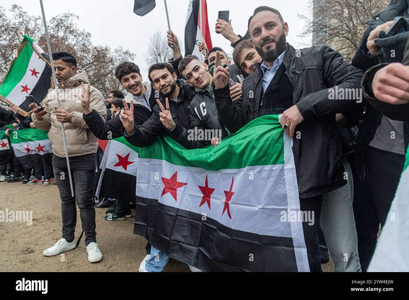 Berlin, Germany. 08th Dec, 2024. Men hold up a Free Syrian Army flag ...