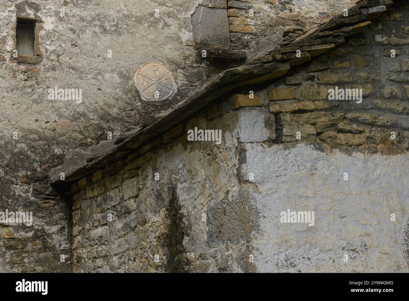 Detailed view of a Romanesque symbol carved into the stone wall of San ...