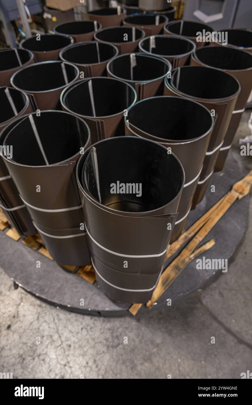 Galvanized Roll Valley black in factory workshop Stock Photo - Alamy