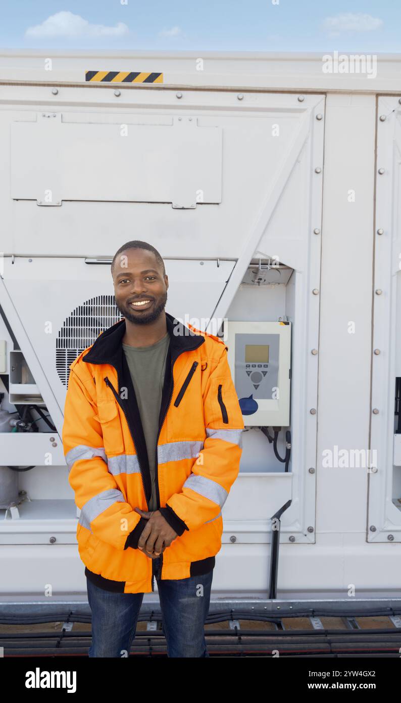 portrait of single african man worker with orange safety jacket ...