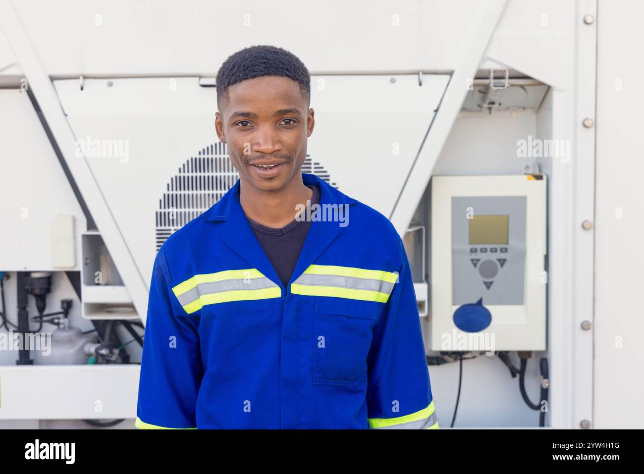 portrait of single african man worker industrial setting outdoors in ...