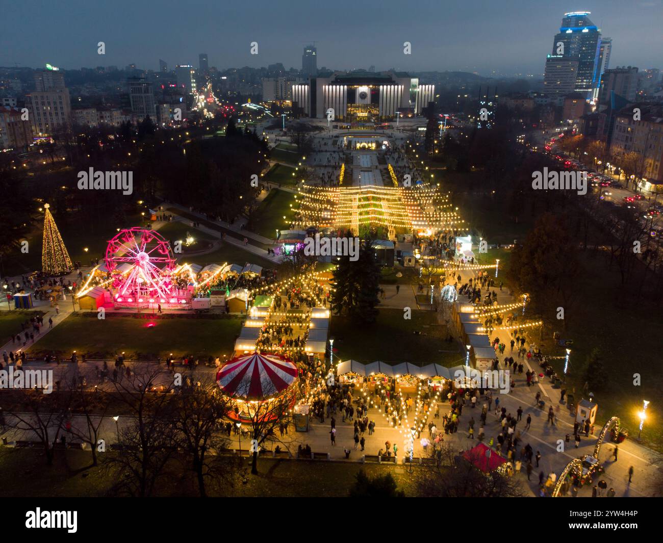 Drone view at slow shutter speed at lights of the Sofia Christmas Festival in front of the ...