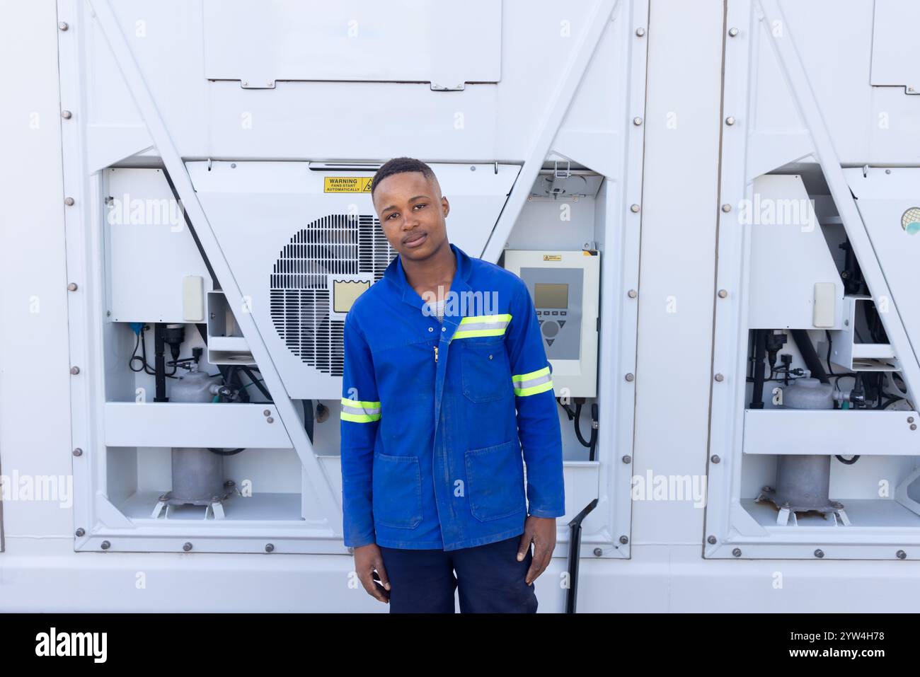 portrait of single african man worker industrial setting outdoors in ...