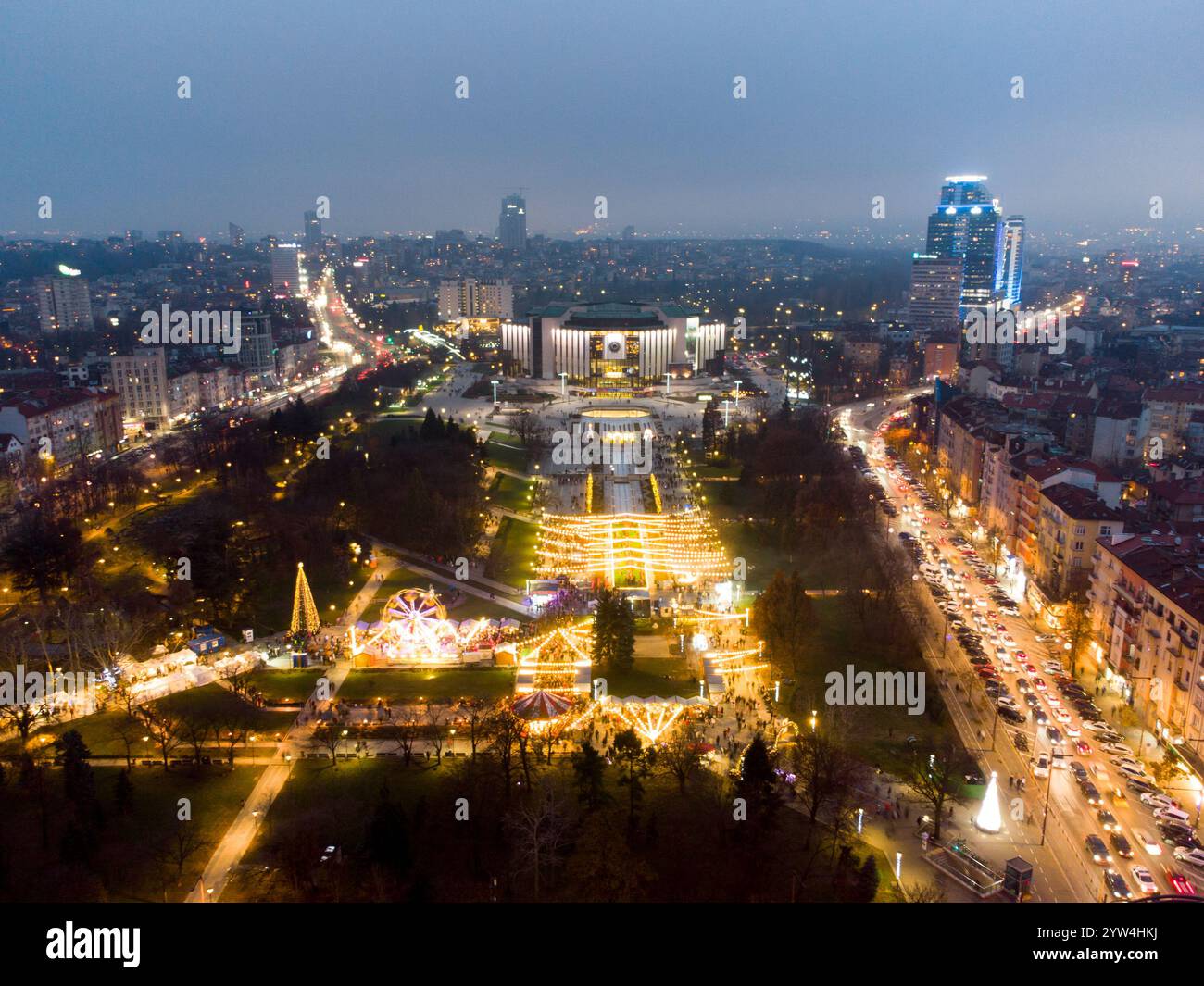 Drone view at slow shutter speed at lights of the Sofia Christmas Festival in front of the ...
