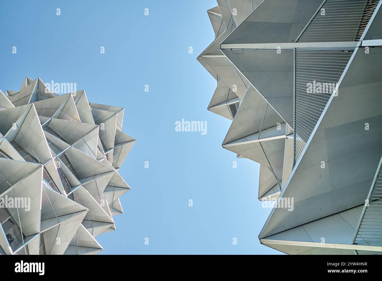 Facade of modern residential building with geometric shapes against ...