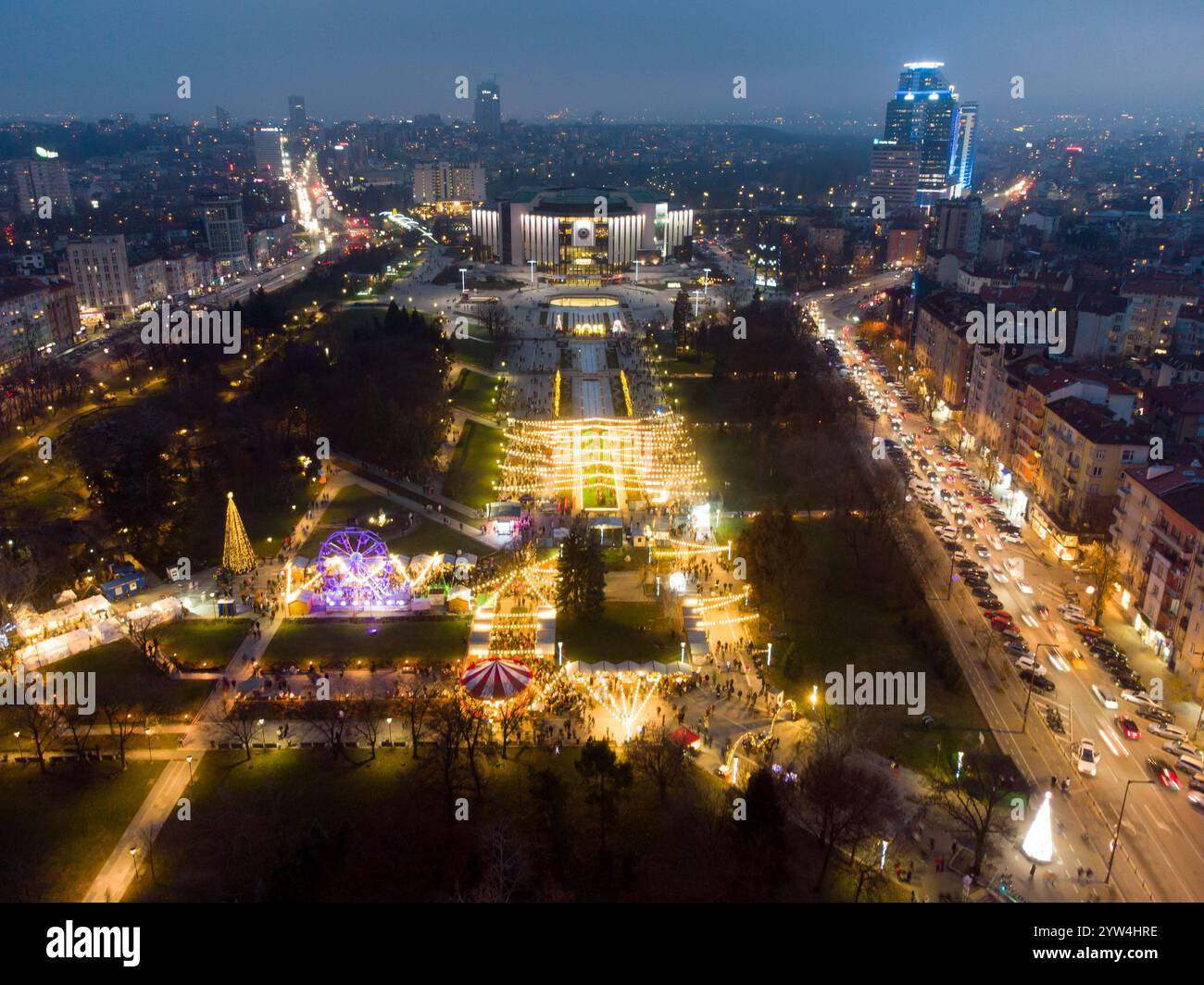 Drone view at slow shutter speed at lights of the Sofia Christmas Festival in front of the ...