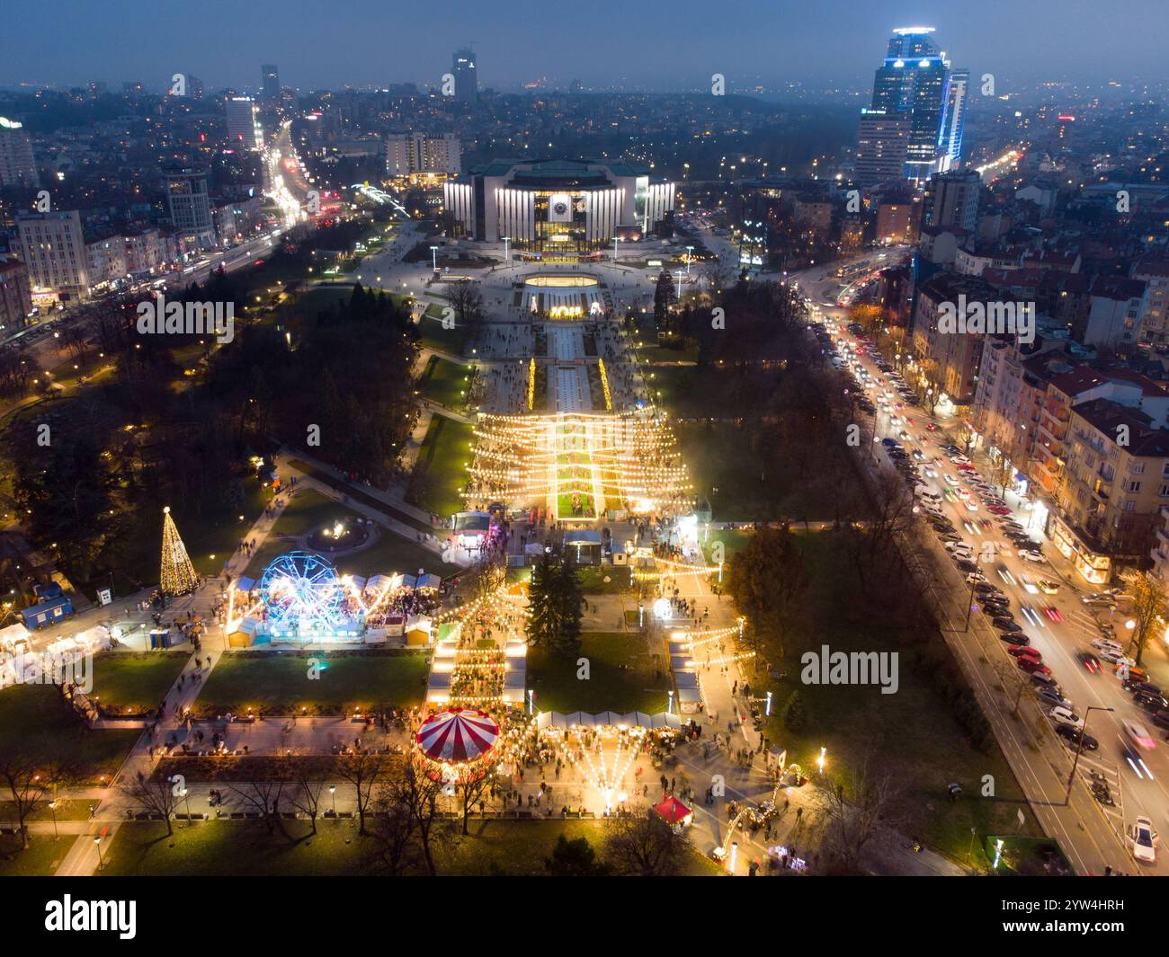 Drone view at slow shutter speed at lights of the Sofia Christmas Festival in front of the ...
