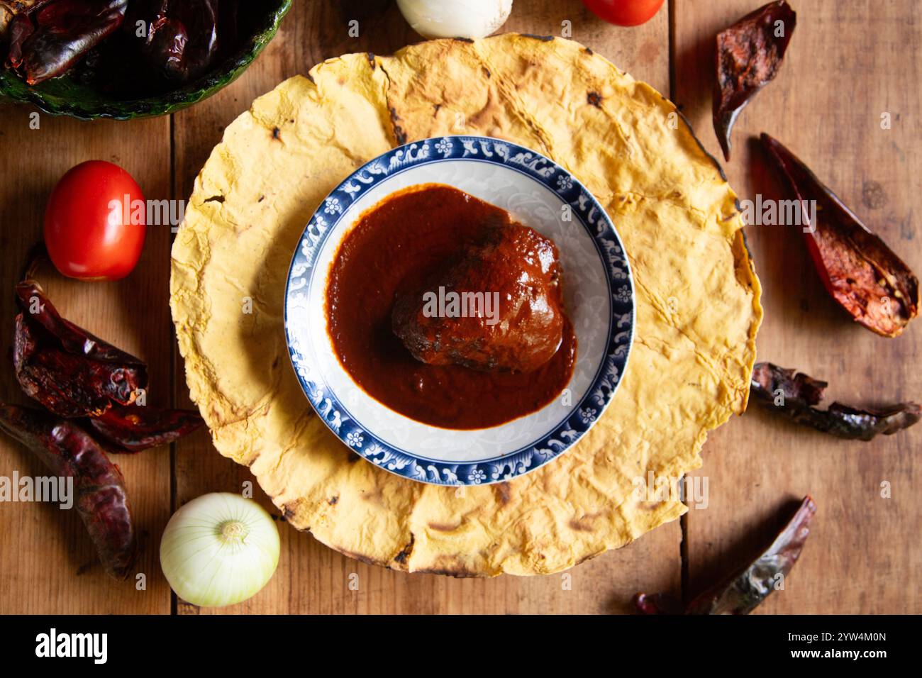 Traditional dish from the gastronomy of Oaxaca in Mexico. Red mole with ...