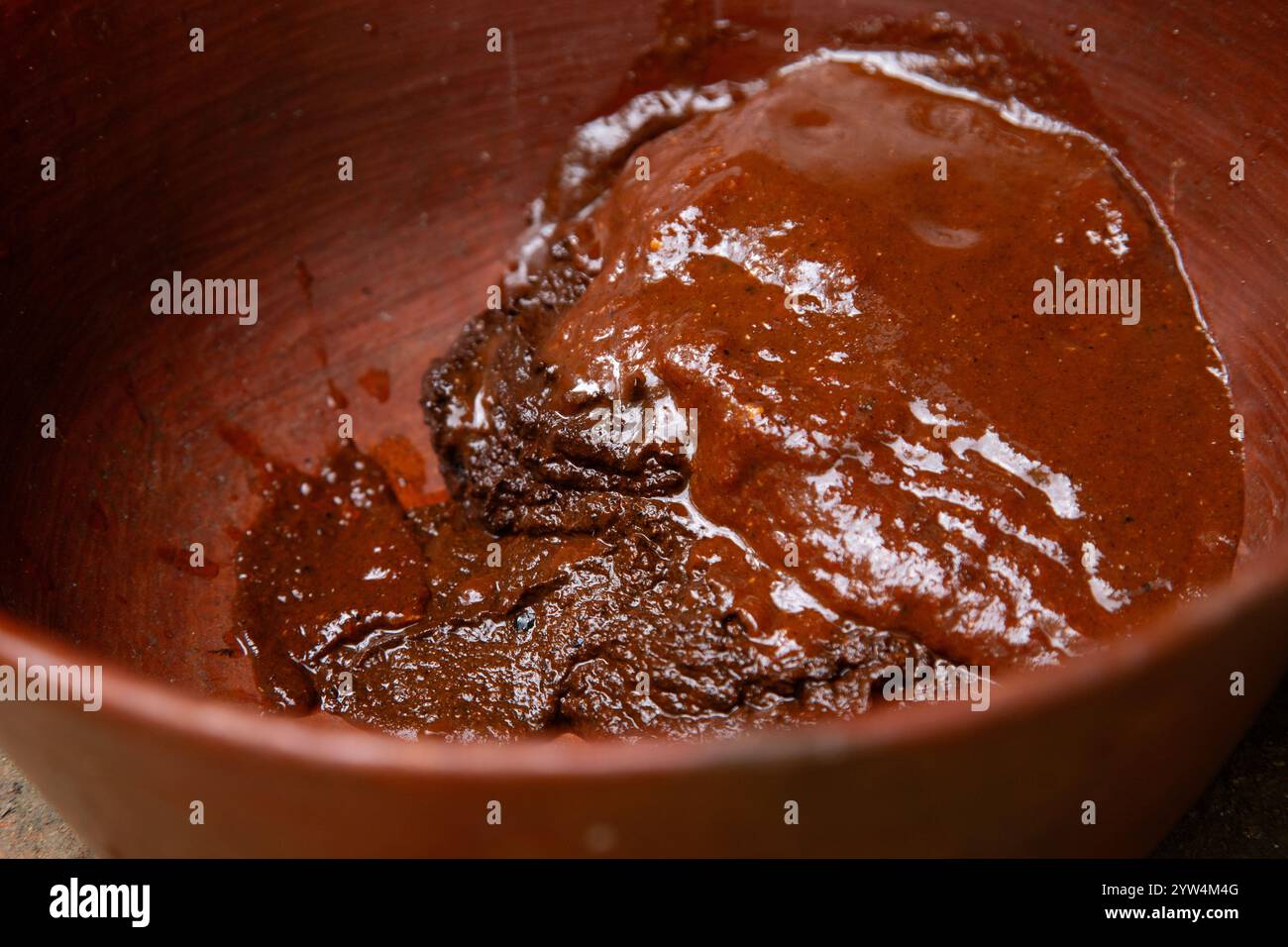 Woman from an indigenous community in Oaxaca preparing traditional Mole ...