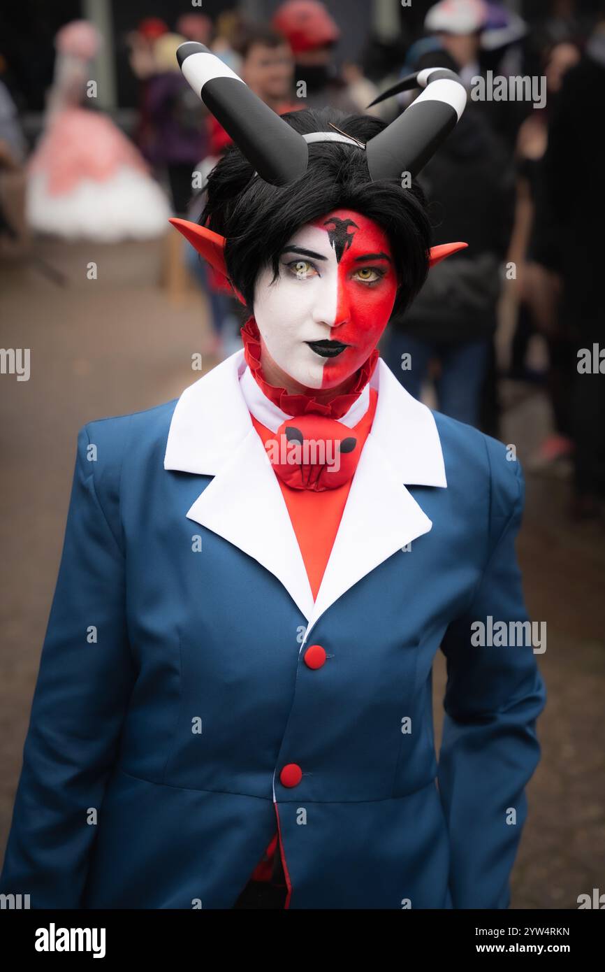 A close up portrait of a pretty female cosplayer dressed as an Anime ...