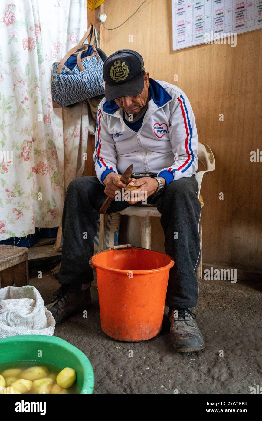 Old man peels potatoes hi-res stock photography and images - Alamy
