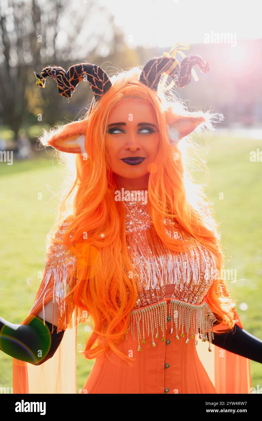 A beautiful teenage girl cosplayer dressed as a demon Empress from the ...