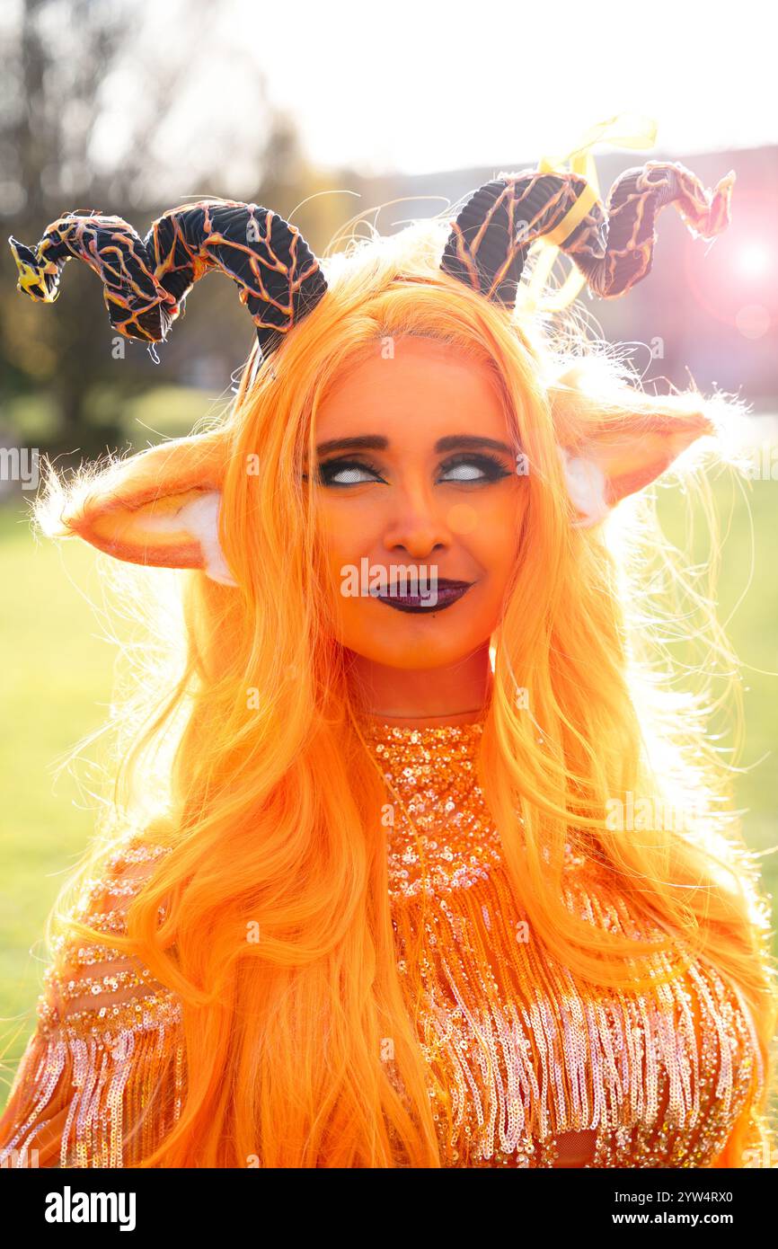 A beautiful teenage girl cosplayer dressed as a demon Empress from the ...