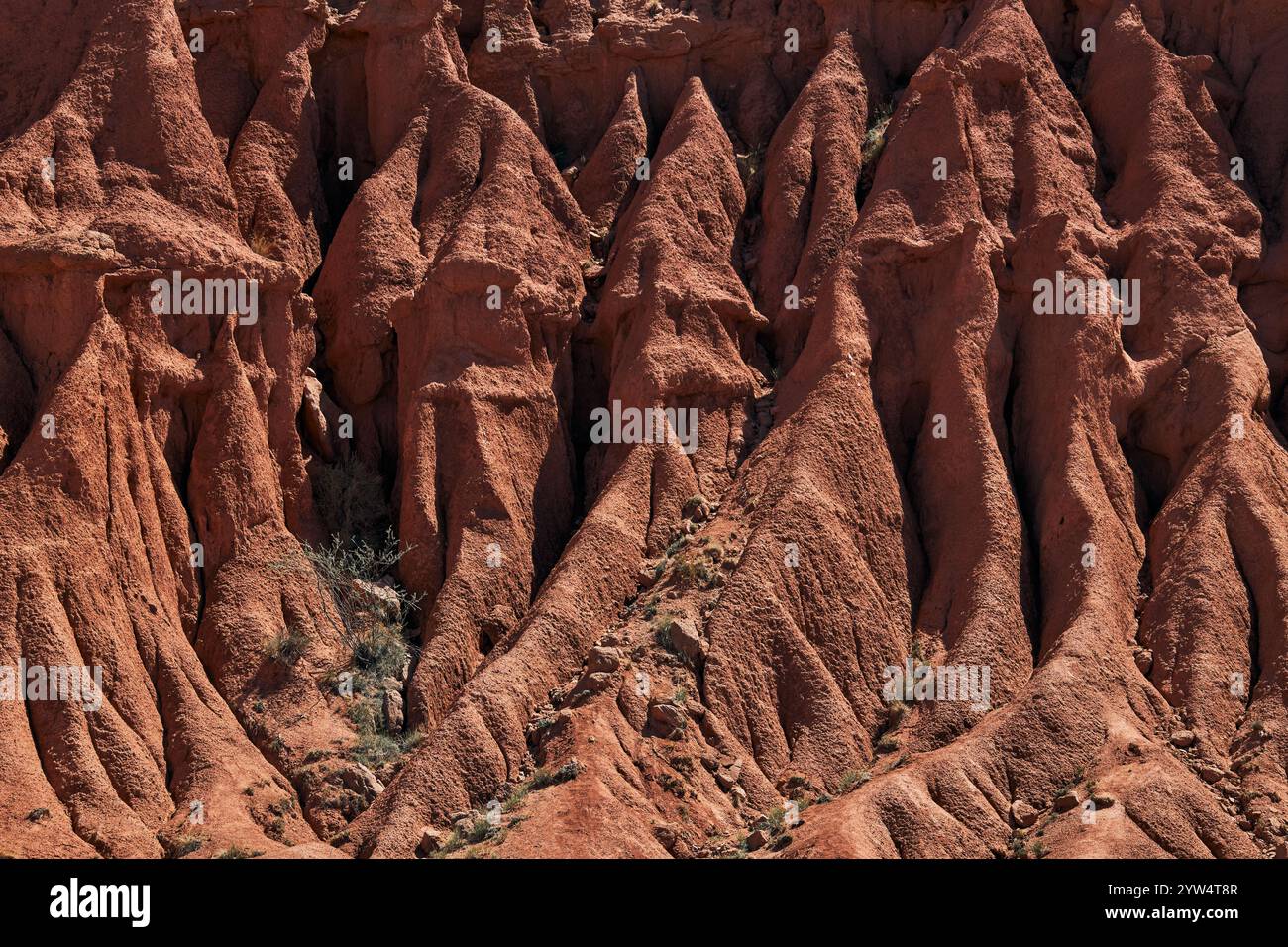 red rugged sandstone, natural landscape background. eroded soil close ...