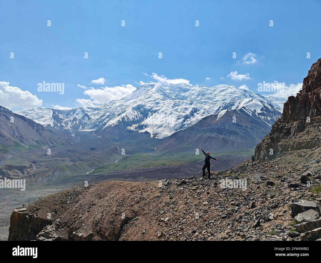 Hiker stands triumphantly on hi-res stock photography and images - Alamy