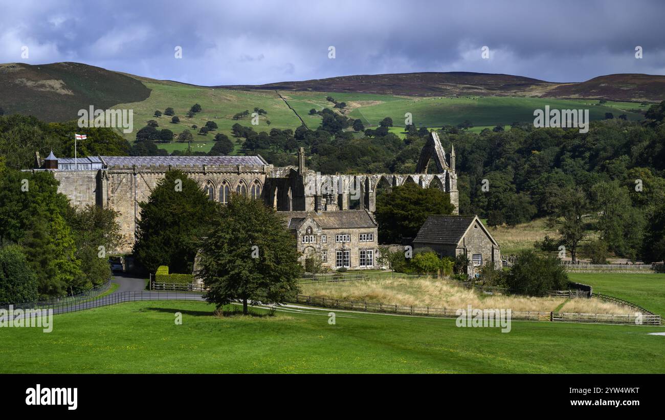 Scenic rural view over ancient, picturesque sunlit monastic ruins of ...