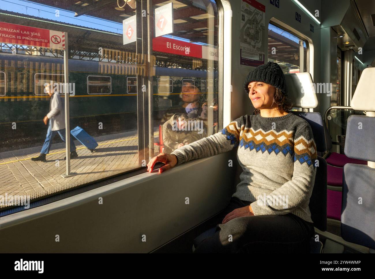 Passenger enjoying a scenic train ride, with a window view of the ...