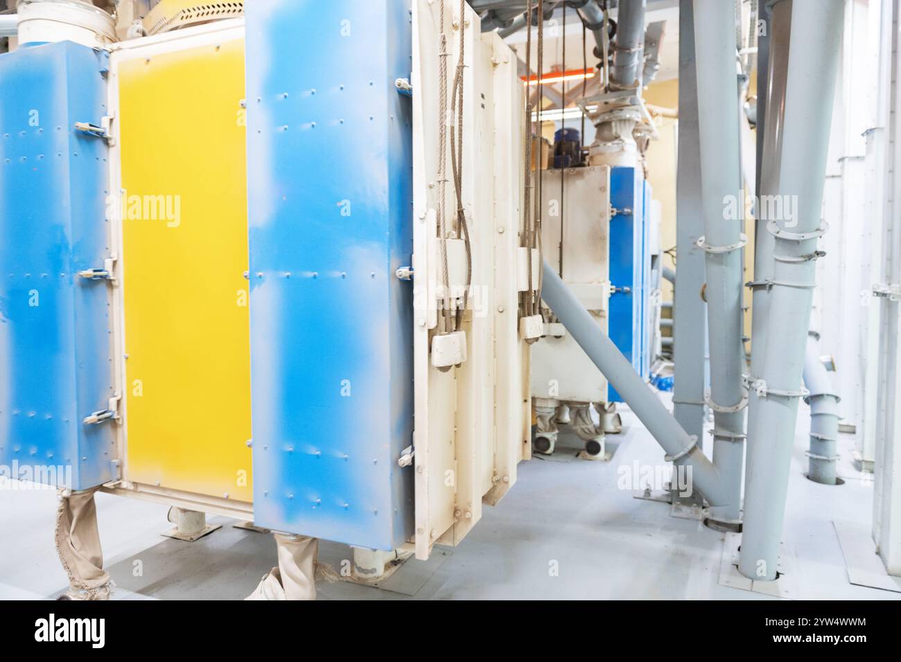 Roller deck machines for husking buckwheat grain Stock Photo - Alamy