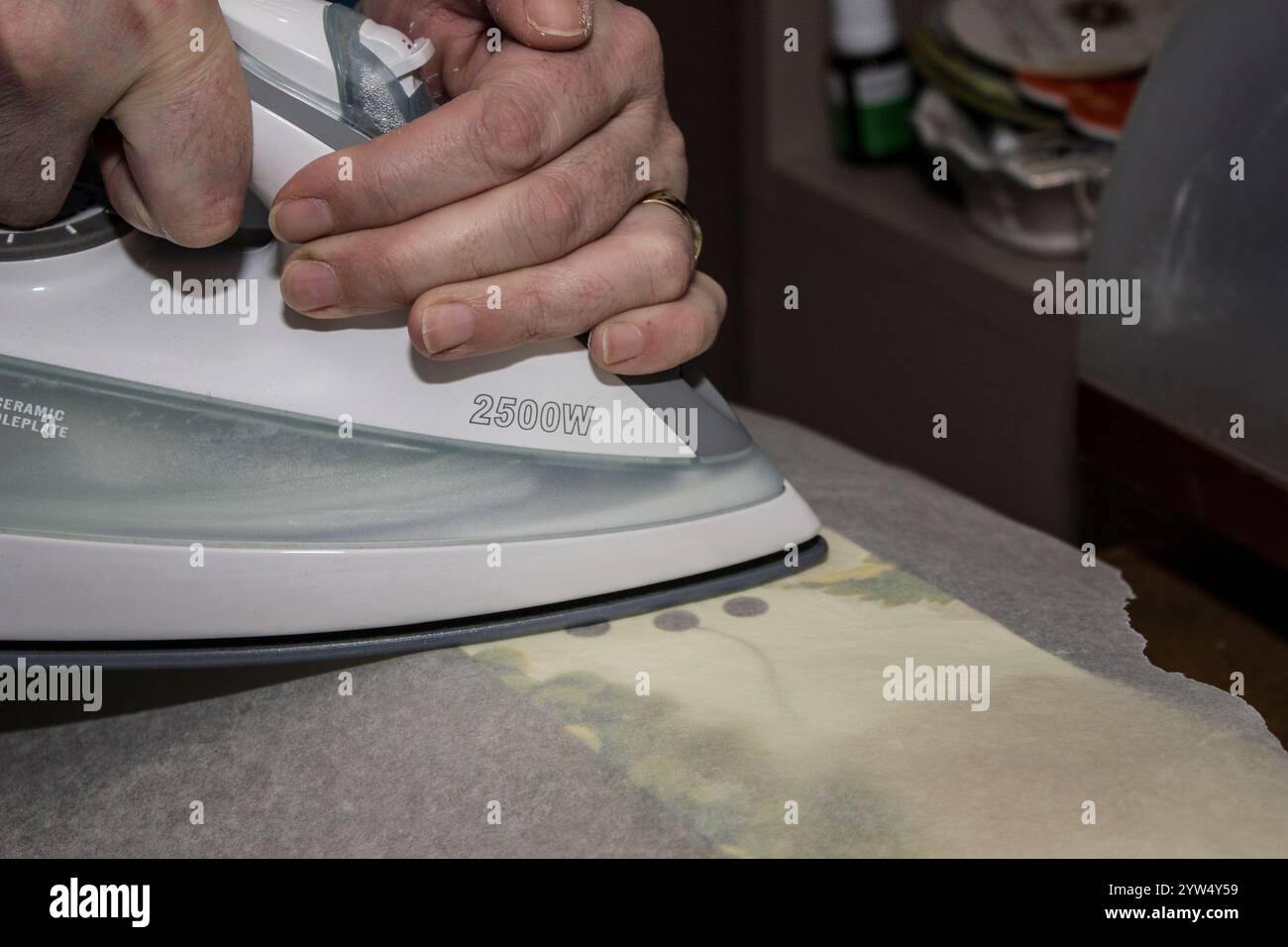 Steam is used to eliminate wrinkles from fabric Stock Photo - Alamy