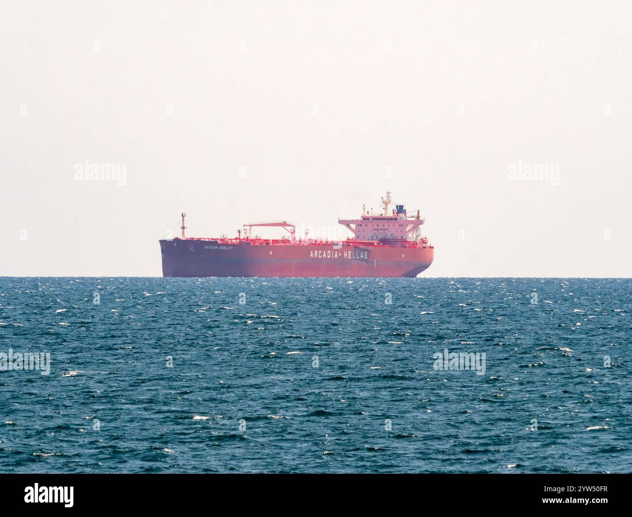 Sea freighter sailing in the middle of the ocean with big waves Stock ...