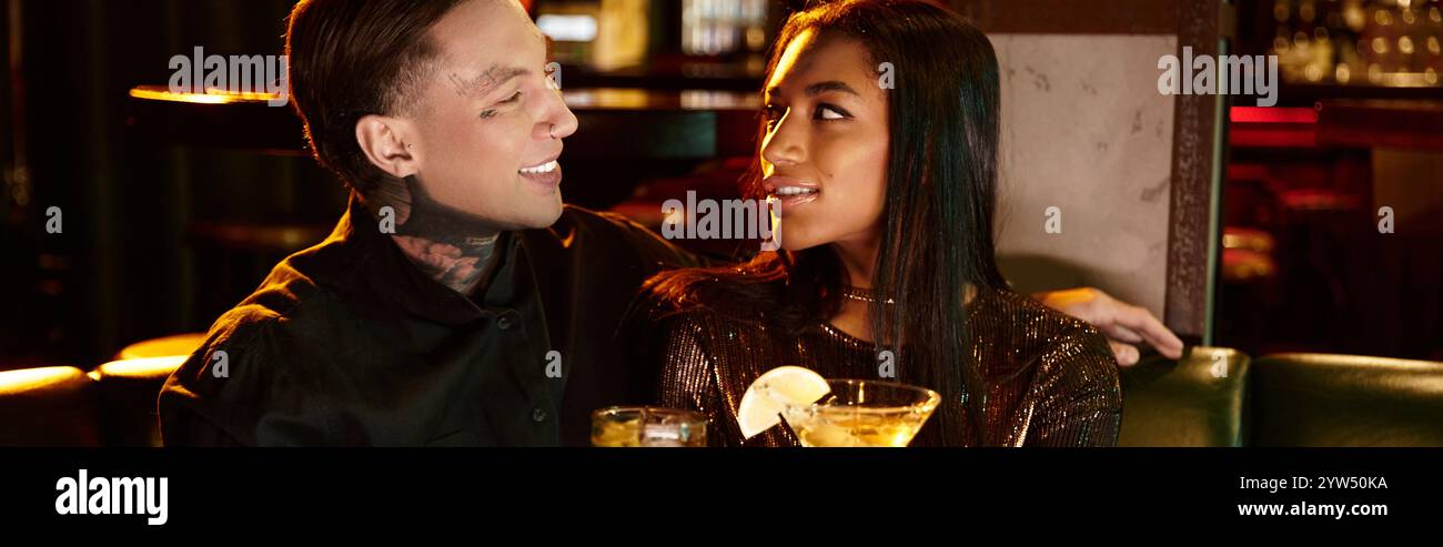 A young couple shares a moment at a bar, engaging in deep conversation ...