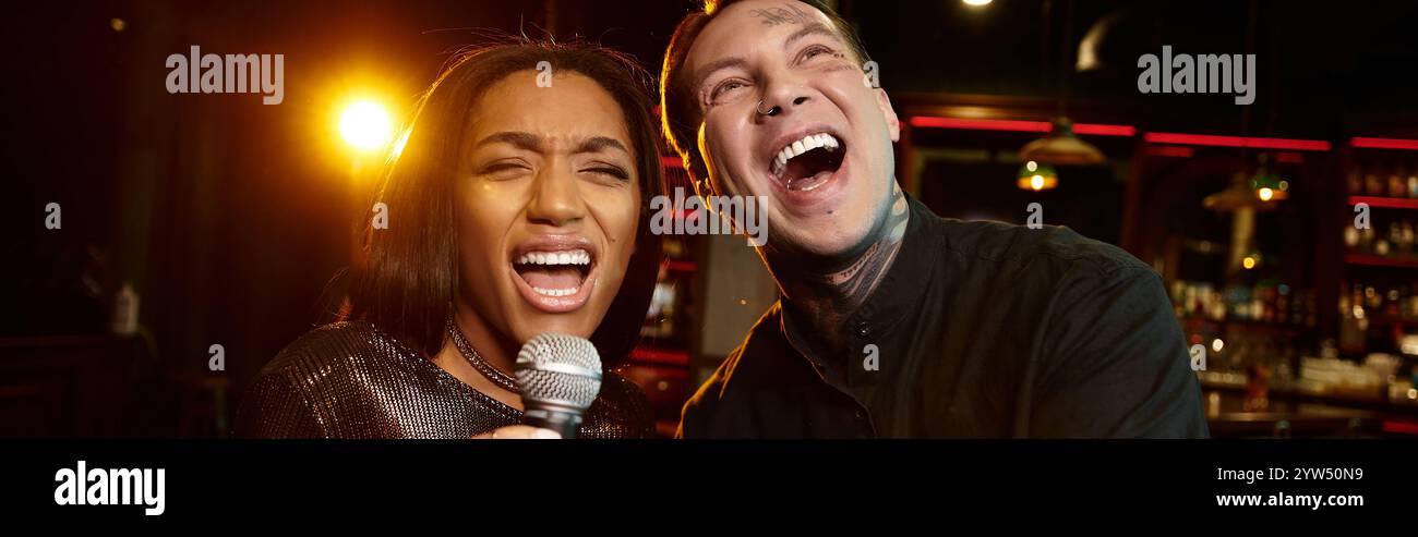 A young couple shares joyful moments while singing together at a lively ...
