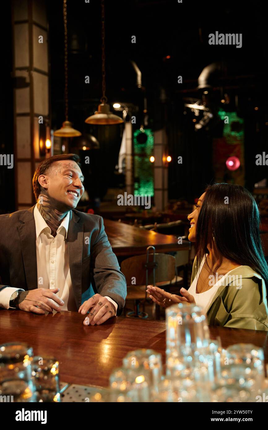 A young couple shares laughter and connection over drinks in a vibrant ...
