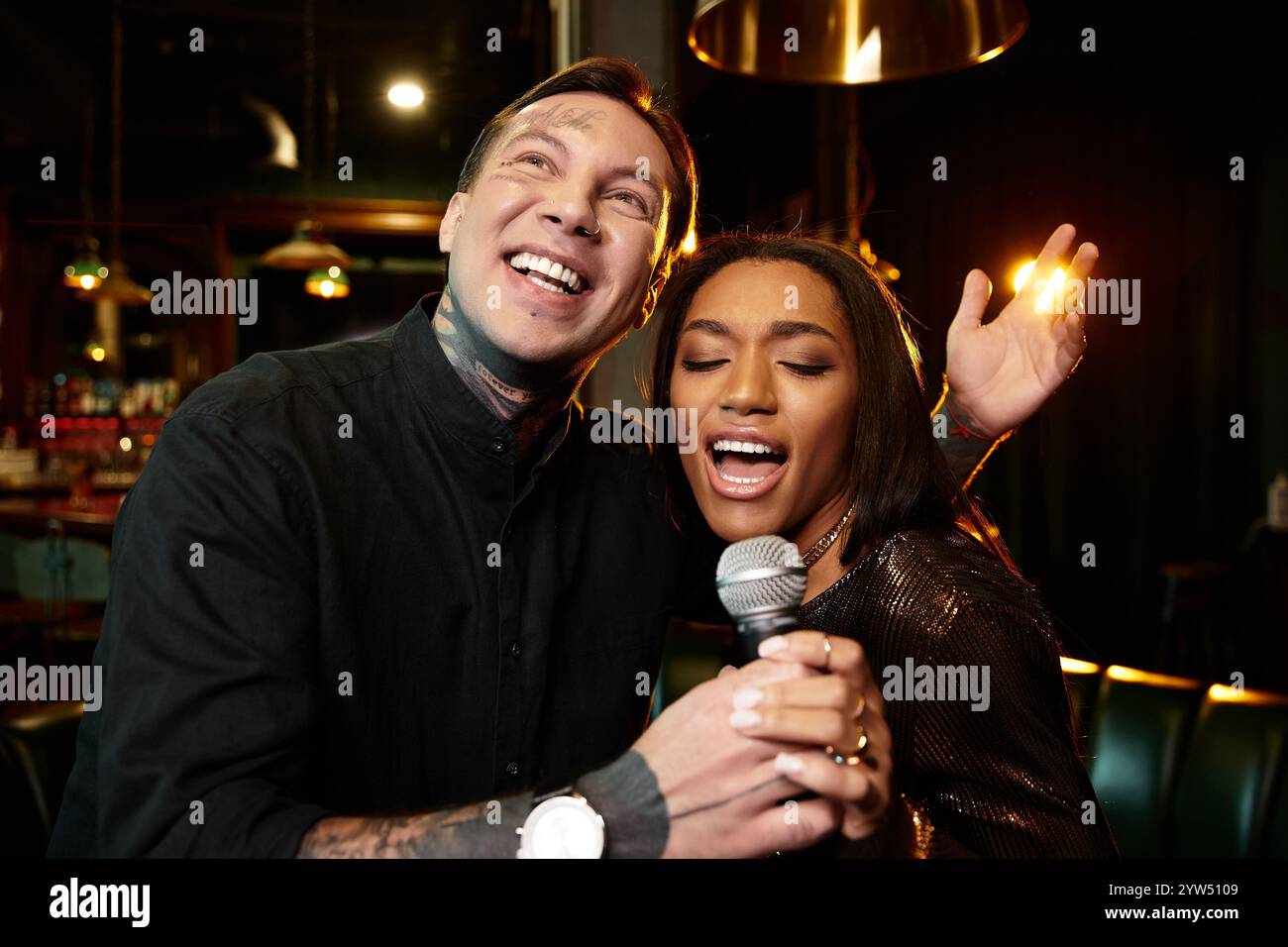 A young couple sings passionately at the bar during their unforgettable ...