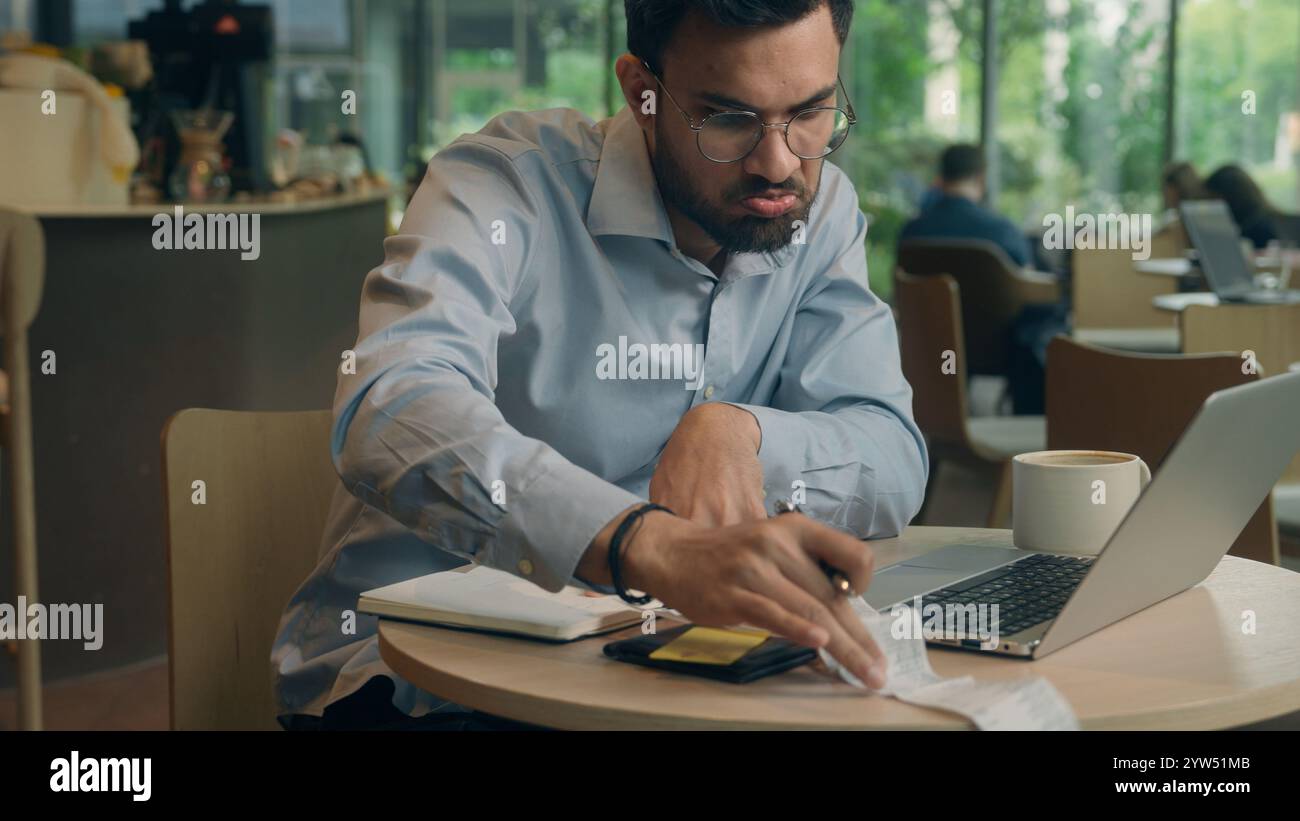 Arabian Indian business man guy education studying write notes in cafe ...