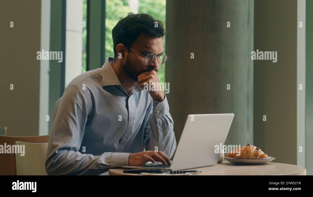 Arabian Indian man typing laptop keyboard concentrated business guy ...