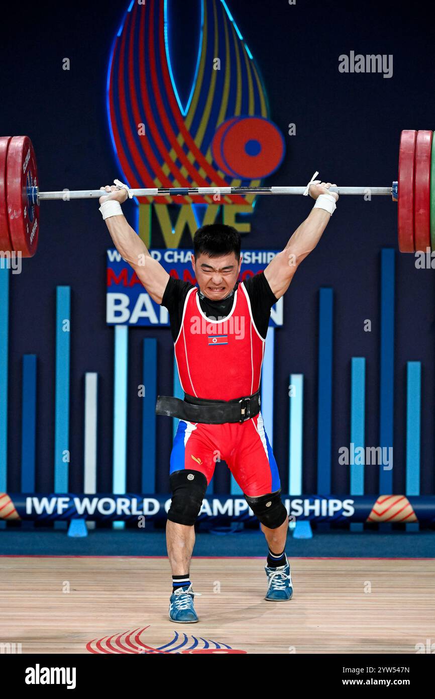 Un Chol Pang of Chinese Taipei competes in clean & jerk, in the 55 kg ...