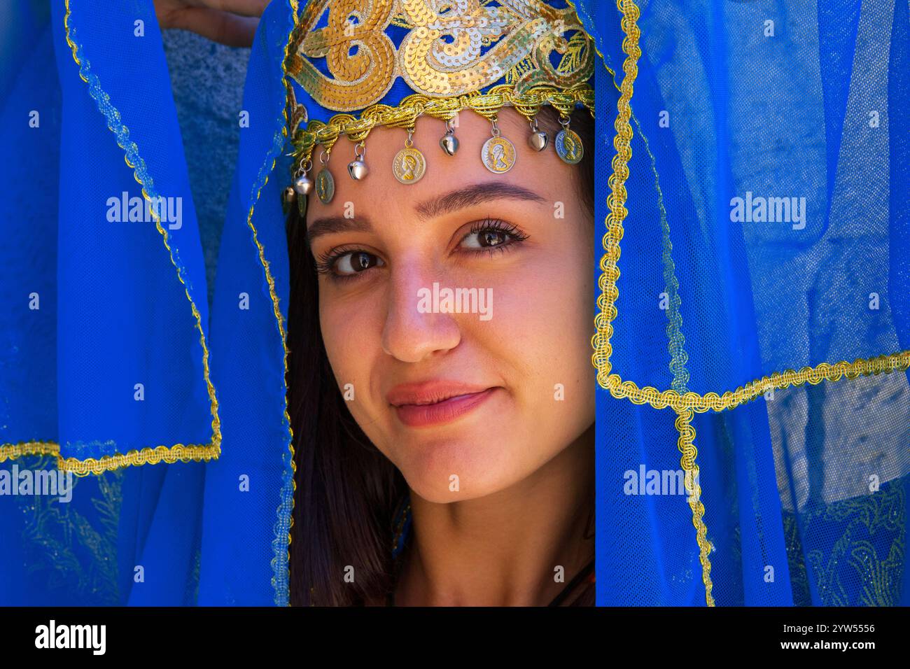 A beautiful young girl in traditional Azerbaijani attire at Icheri ...
