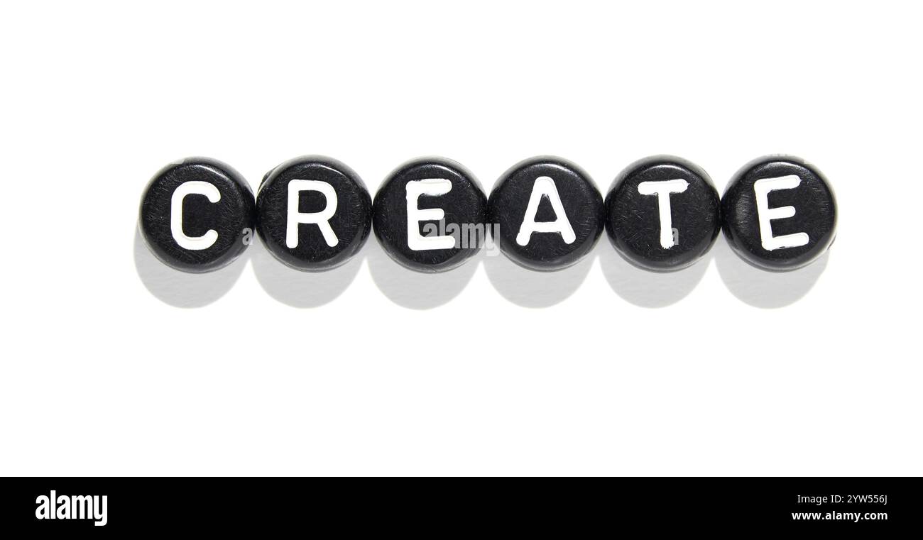 Inspiration letter tiles on white background forming the word create in ...