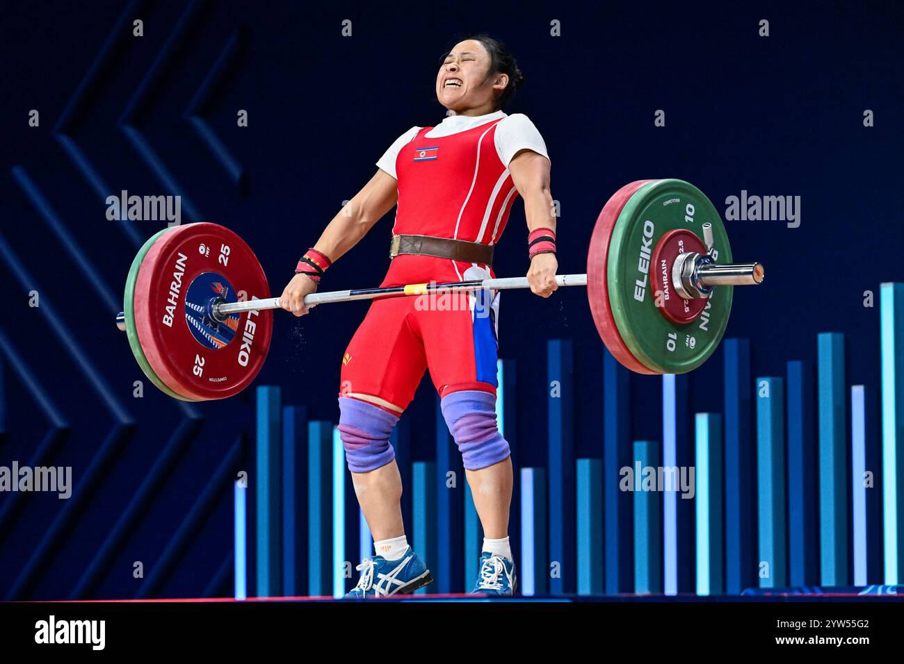 Song Gum Ri of North Korea competes in snatch, in the 49 kg women ...