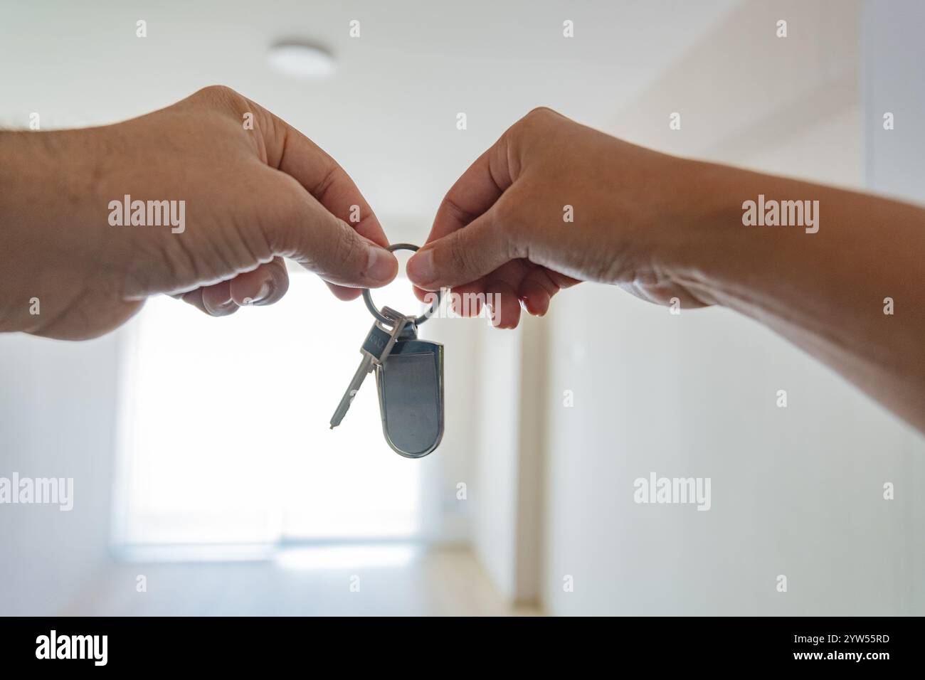 Two people holding keys in their hands. New home concept Stock Photo ...