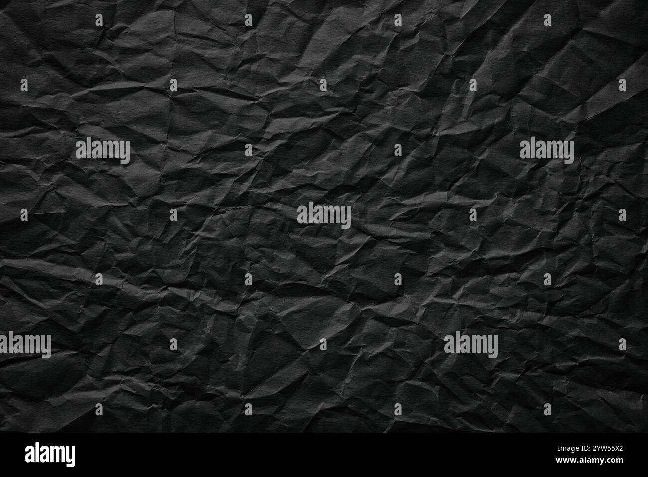 black paper background, crumpled template texture for inserting text ...