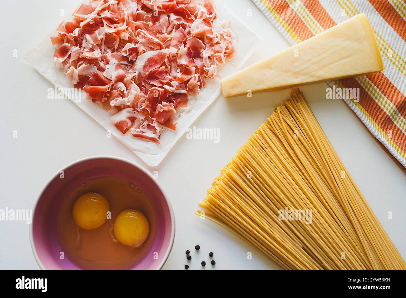 Ingredients for Carbonara Pancetta, eggs and spaghetti on white ...