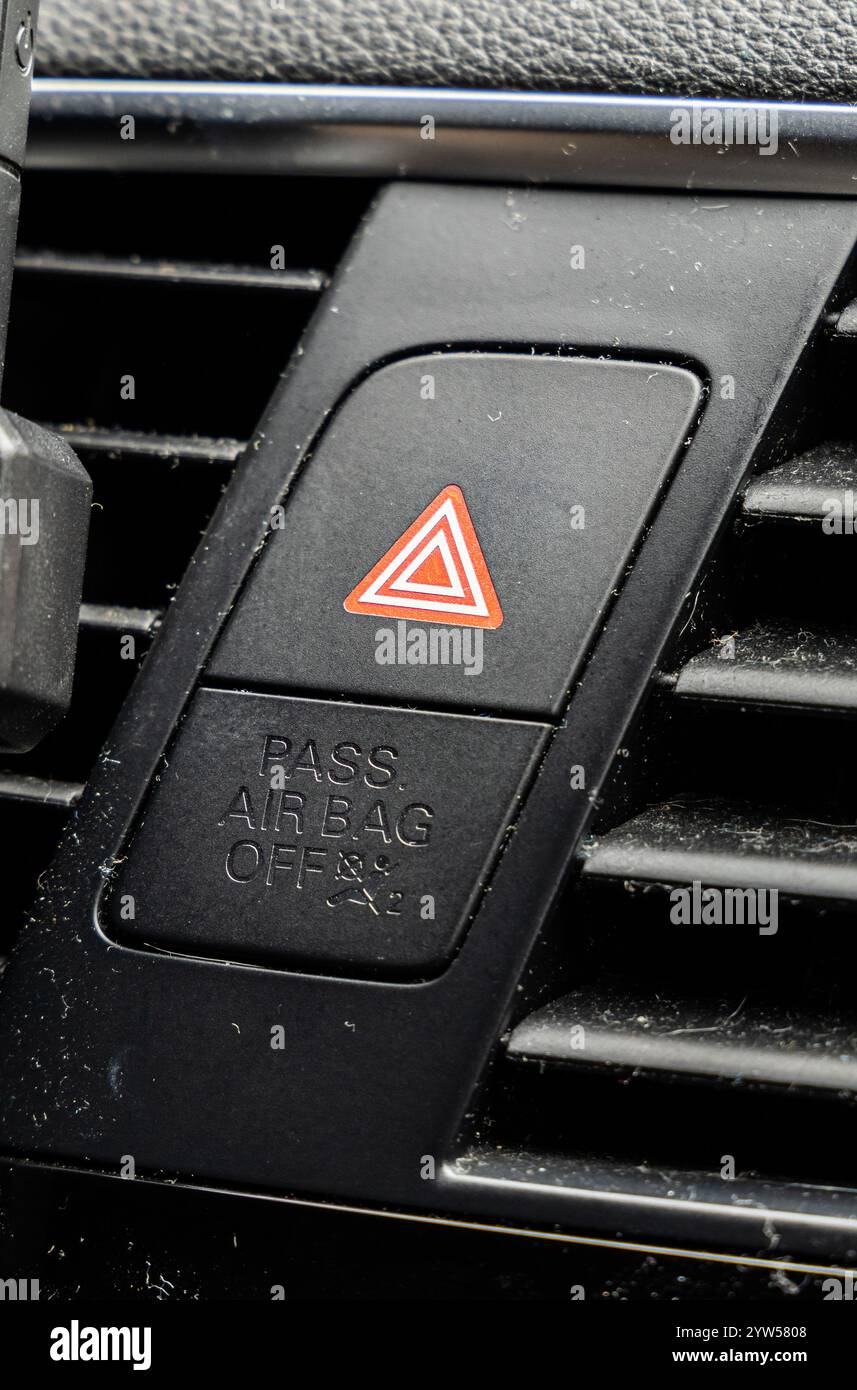 Close up of the Hazard light button feature in the shape of a red ...