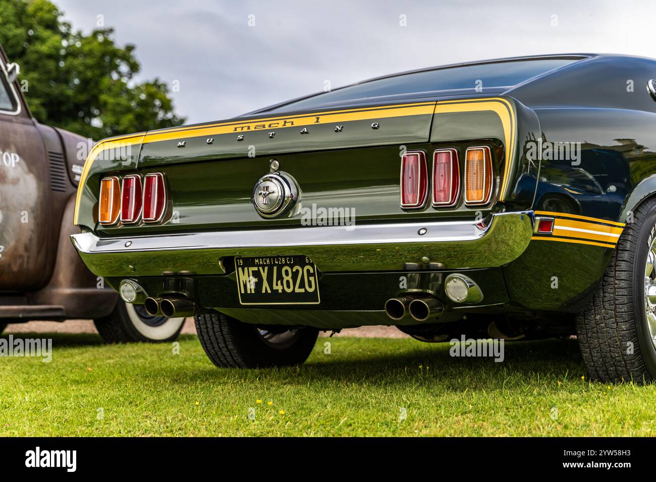 Bristol, UK- August 11, 2024: Rear view of Dark Green Ford Mustang 1969 ...
