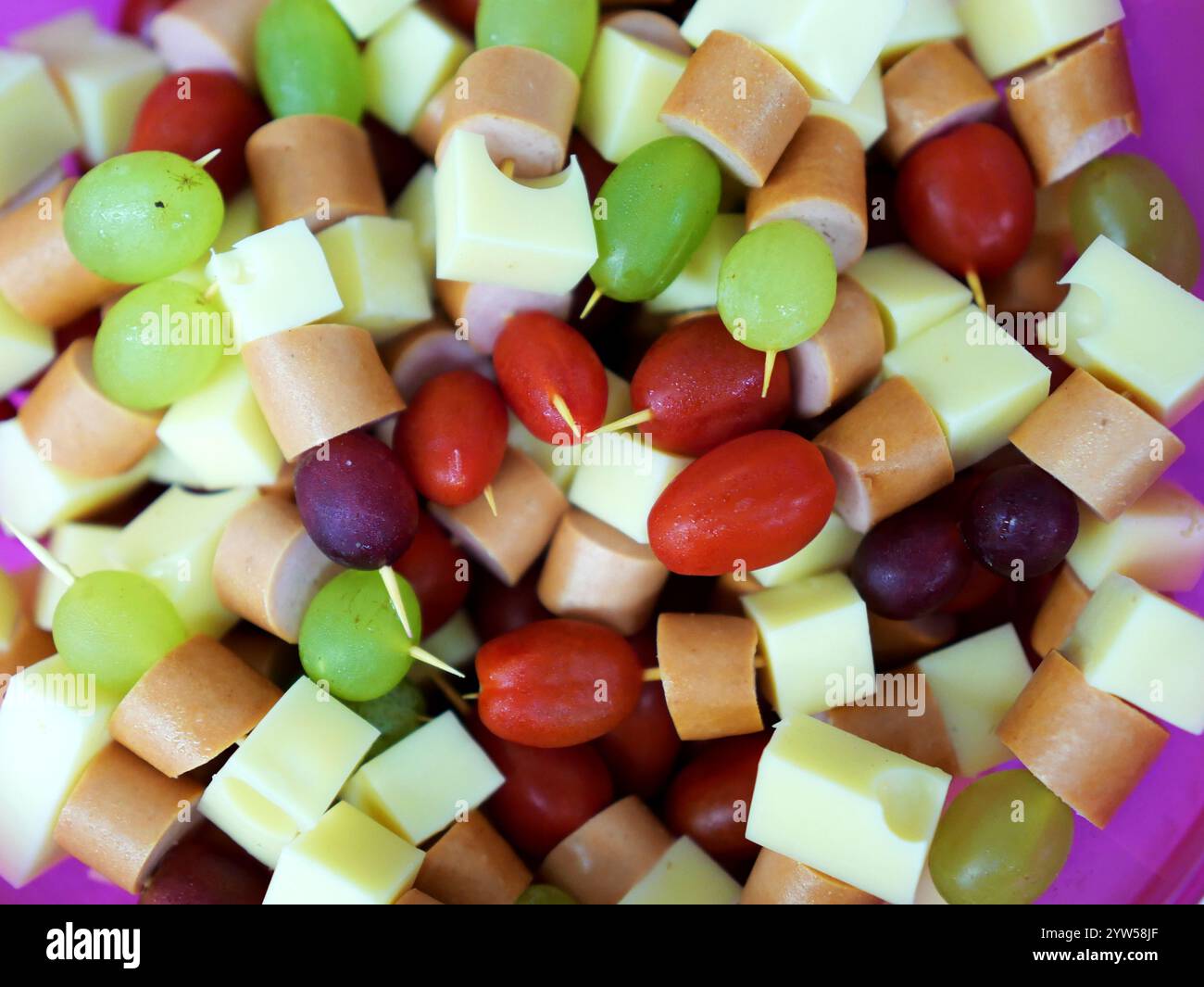 Sticks with cheese, grapes, tomatoes and sausage are popular snacks at ...