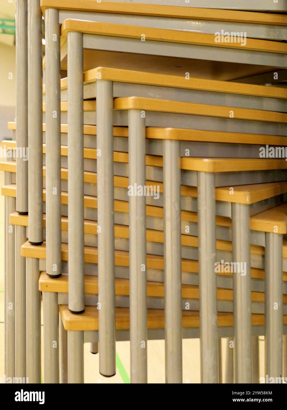 Stackable tables in a sports hall, perfect for exams and events. Space ...