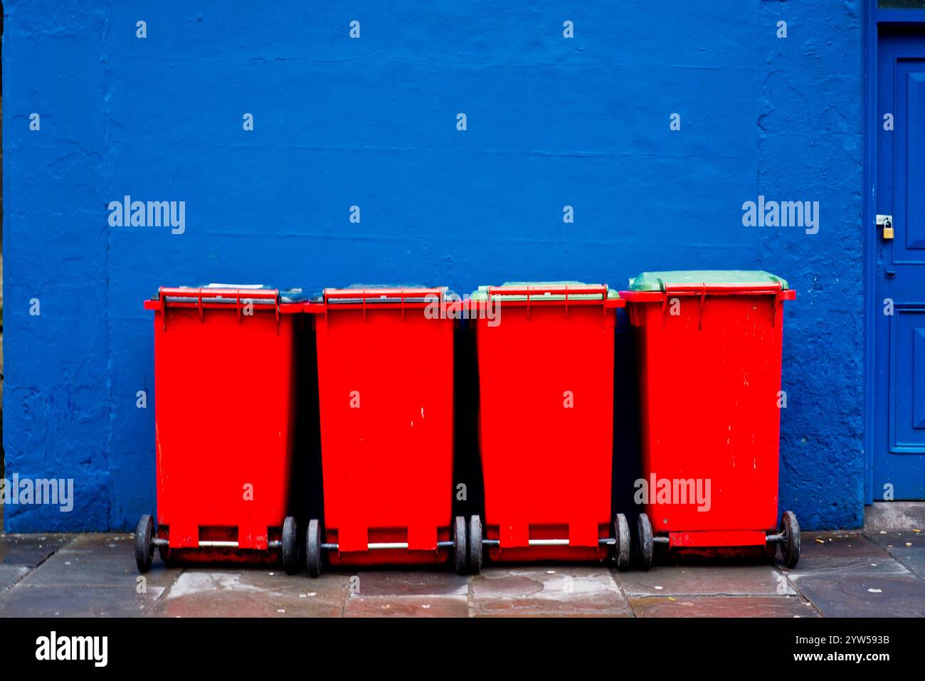 Red bins, Blue Wall, Bath, Somerset, England Stock Photo - Alamy