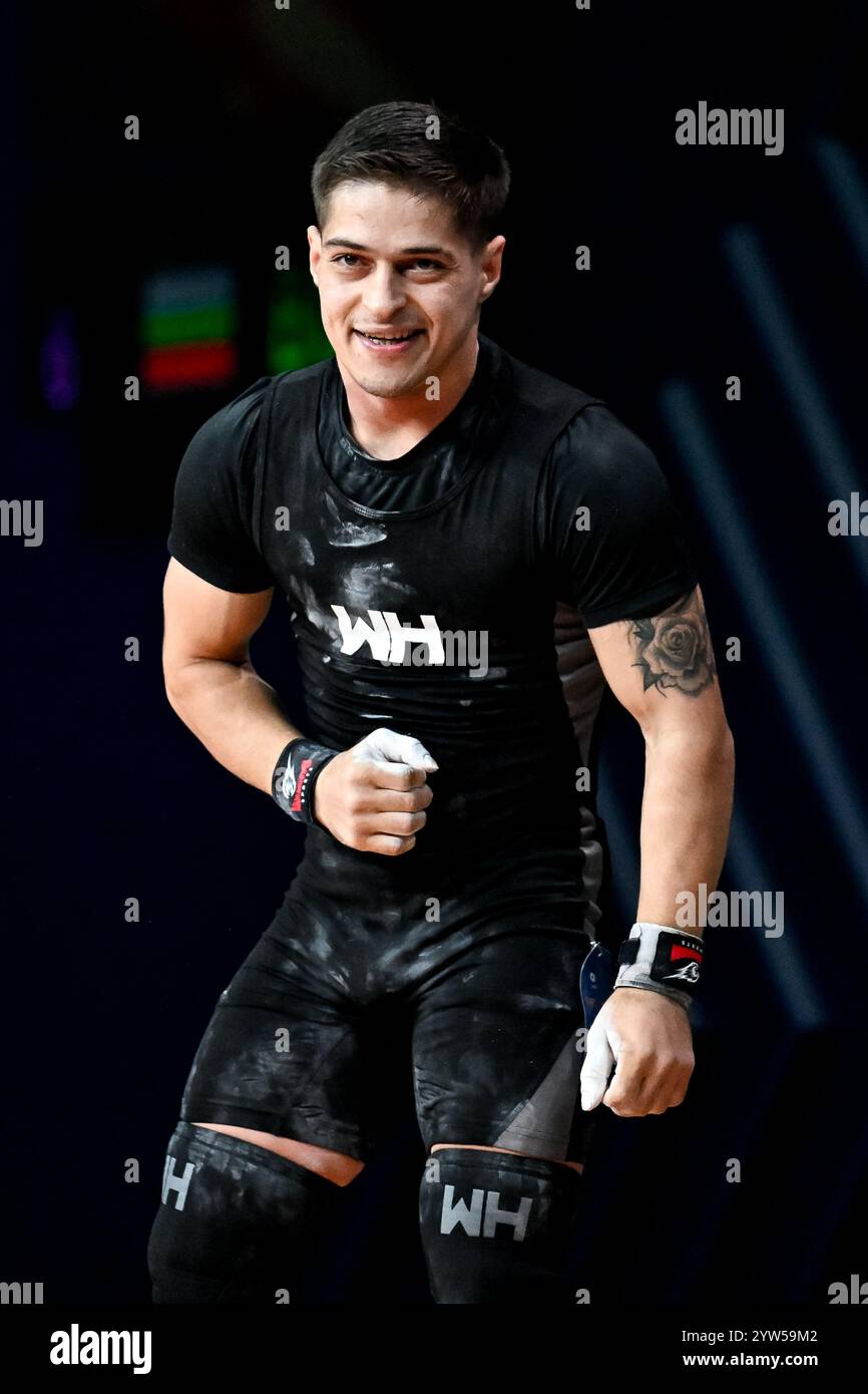 Deniz Gretov Danev of Bulgaria reacts after competing in clean & jerk ...