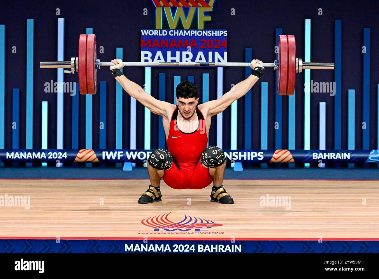Garnik Cholakyan of Armenia competing in the men 61 kG. category during the 2024 IWF World ...